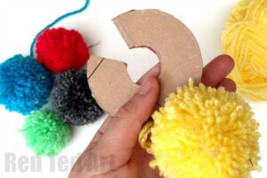 How to make pom poms with a DIY cardboard pom pom maker -RedTedArt